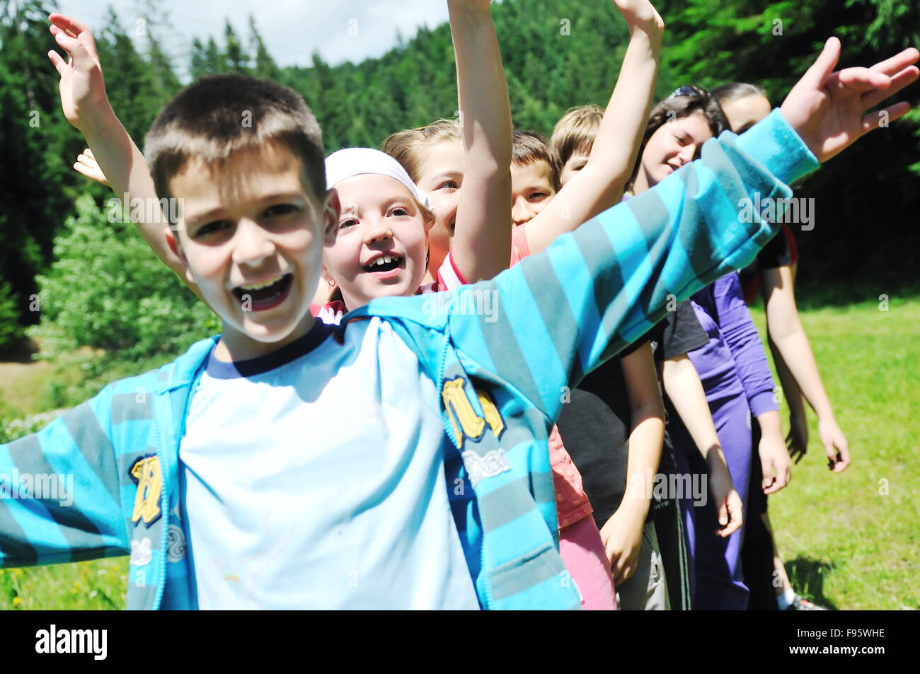 happy children group have fun outdoor in nature at suny day Stock Photo ...