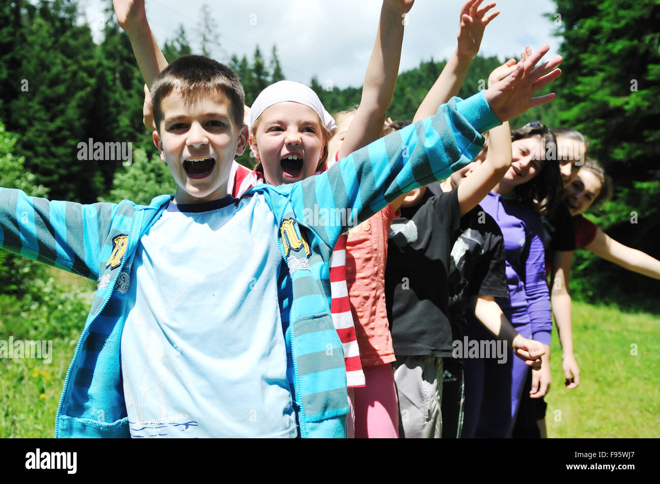 happy children group have fun outdoor in nature at suny day Stock Photo ...