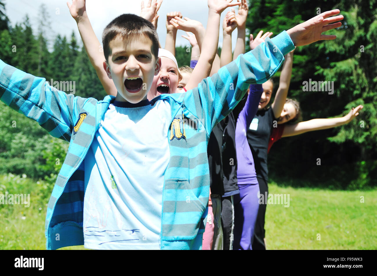 happy children group have fun outdoor in nature at suny day Stock Photo ...
