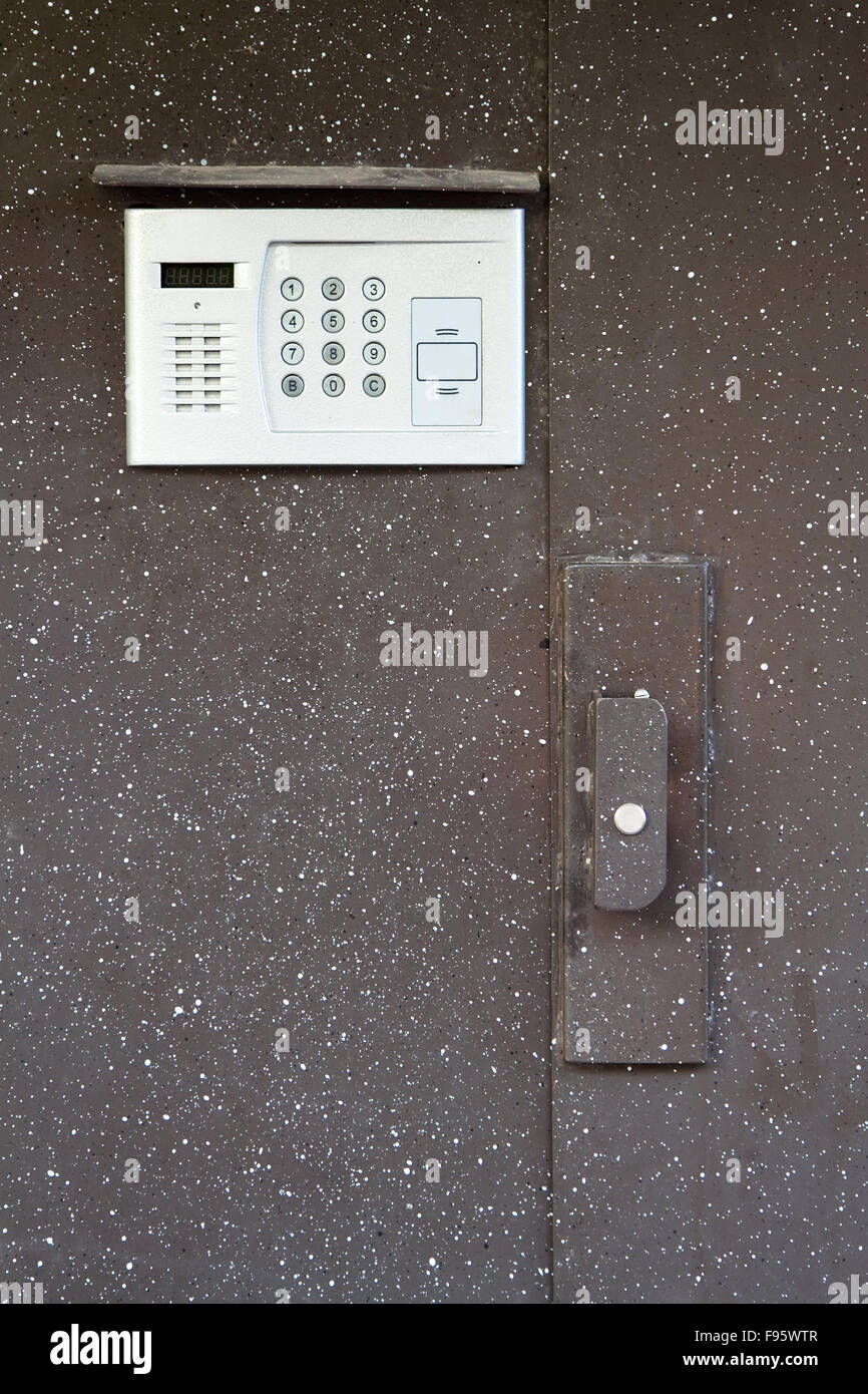 Close-up of building intercom in steel door Stock Photo - Alamy