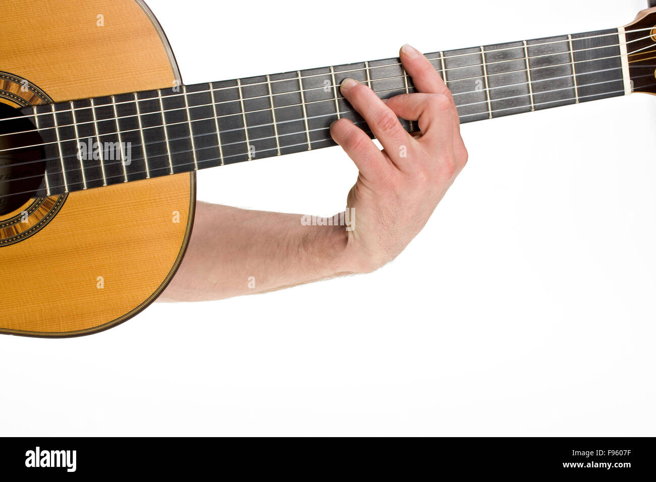 male hand holding a chord on a classsical guitar Stock Photo - Alamy