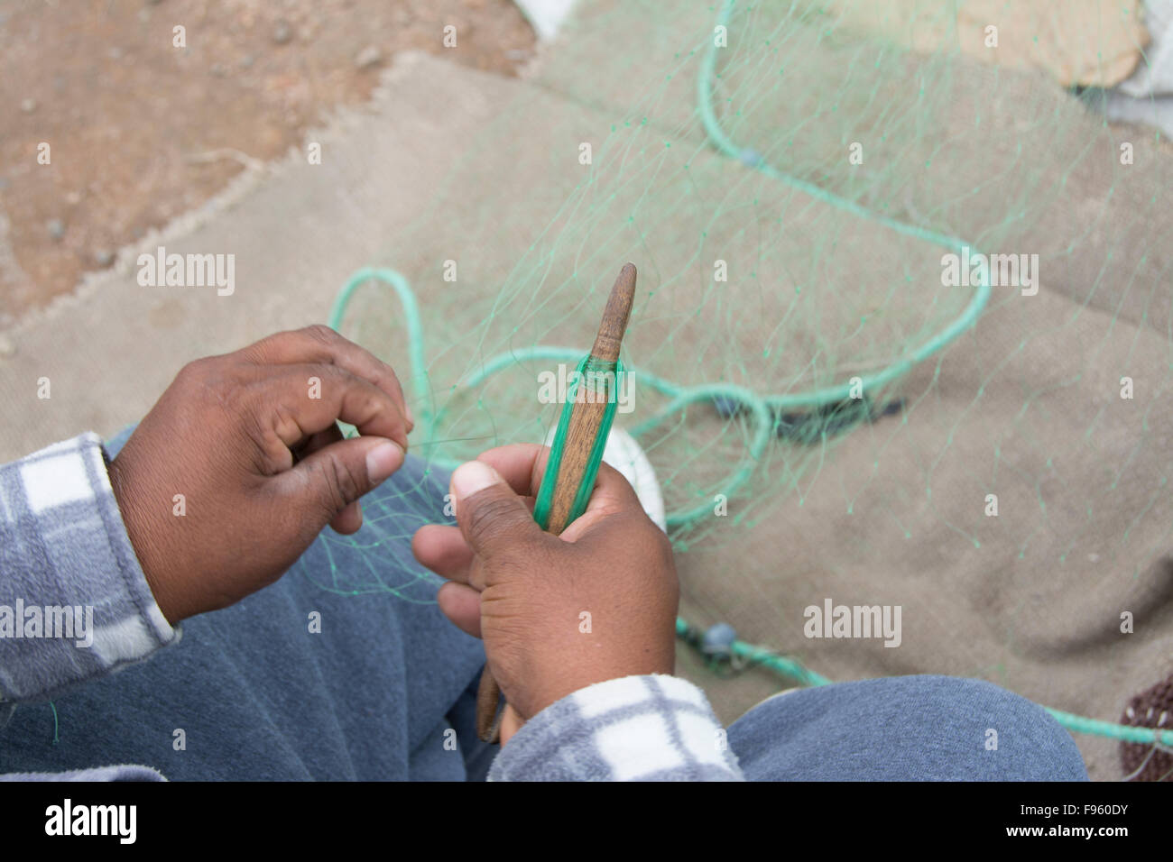Net repair at Miraflores suburb, Lima, Peru Stock Photo - Alamy