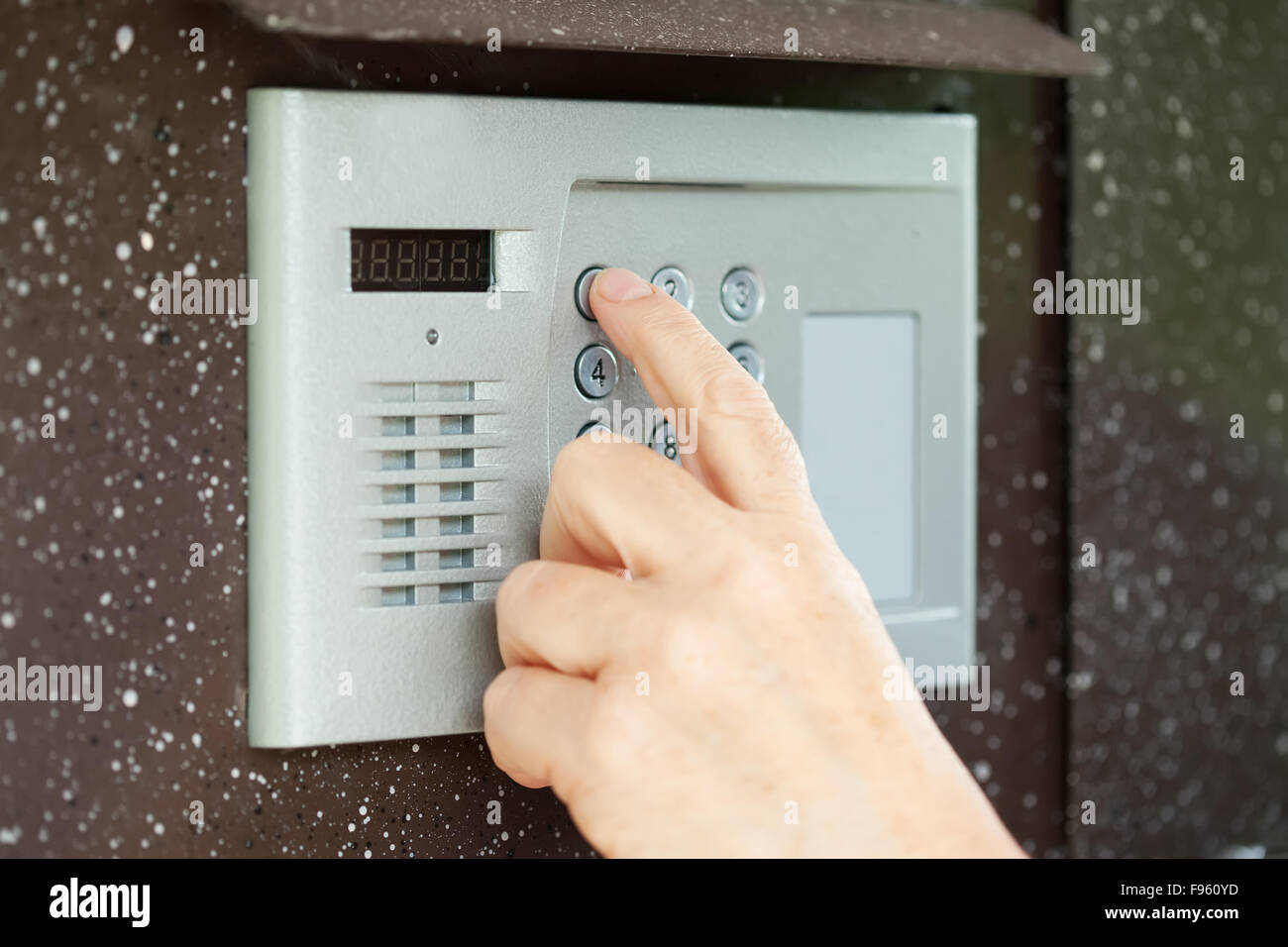 Human finger pushing button of house intercom Stock Photo - Alamy