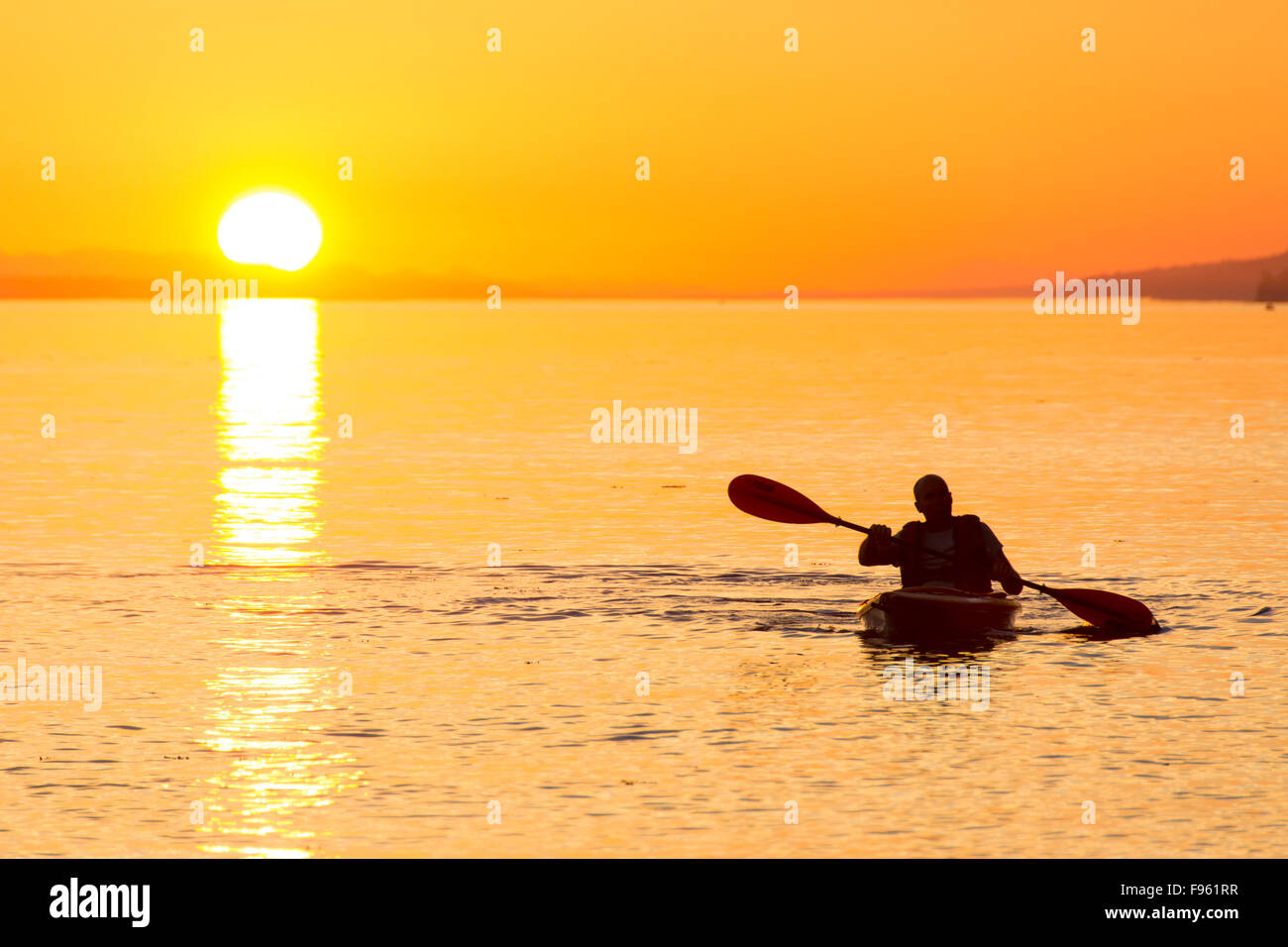 Kayaks in silhouette hi-res stock photography and images - Alamy