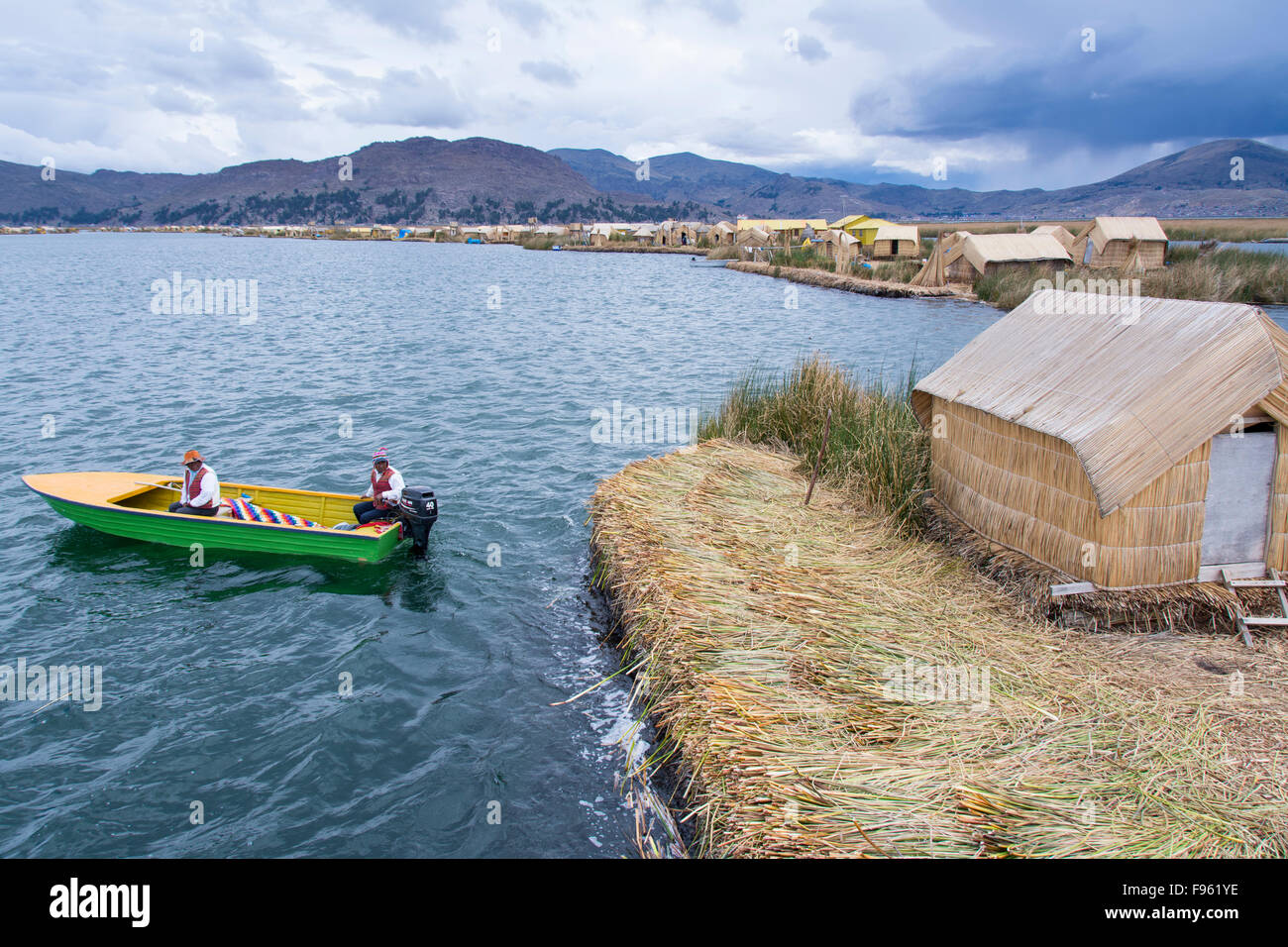 Local residents of floating reed islands of Uros, Lake Titicaca, Peru ...