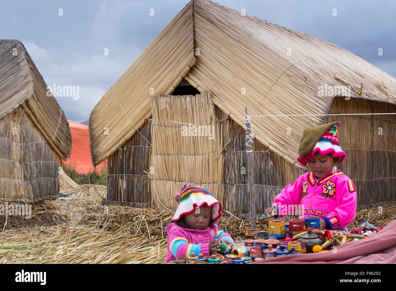 Local residents of floating reed islands of Uros, Lake Titicaca, Peru ...