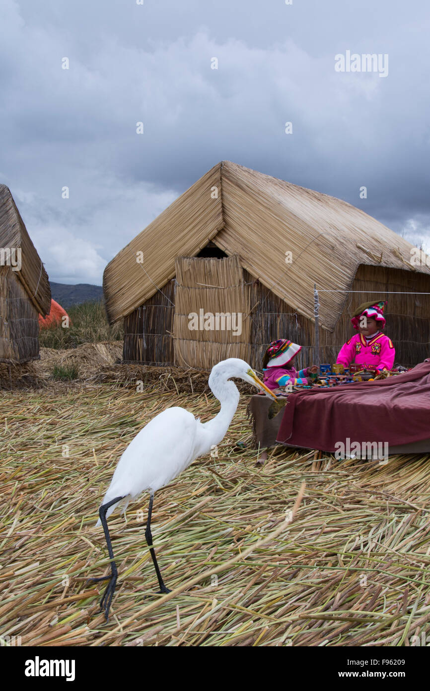 Local residents of floating reed islands of Uros, Lake Titicaca, Peru ...