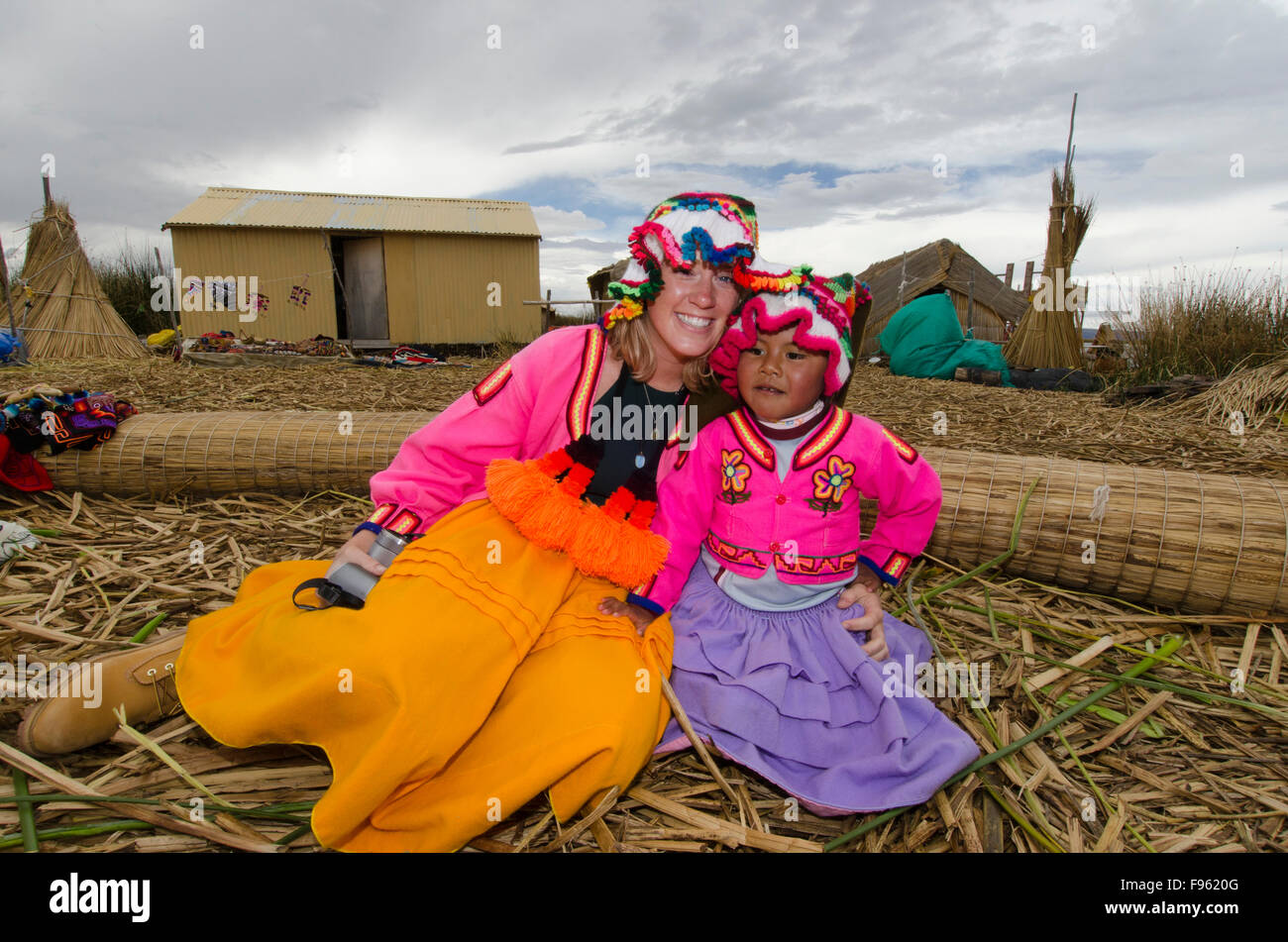 Local residents of floating reed islands of Uros, Lake Titicaca, Peru ...