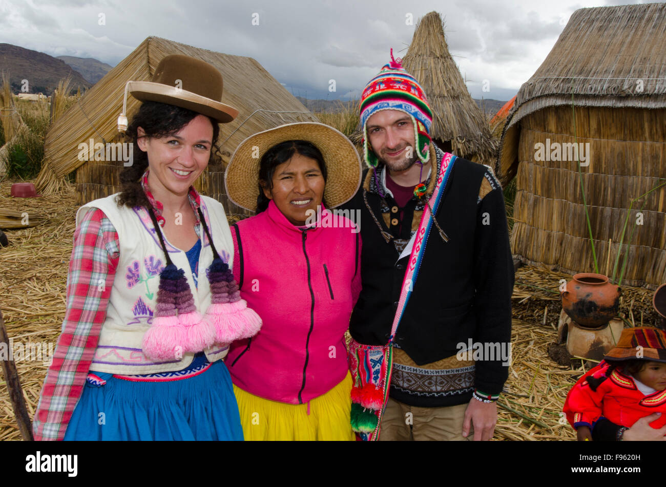 Local residents of floating reed islands of Uros, Lake Titicaca, Peru ...