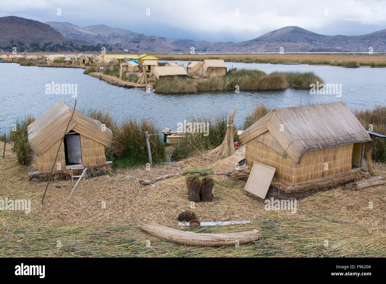 Local residents of floating reed islands of Uros, Lake Titicaca, Peru ...