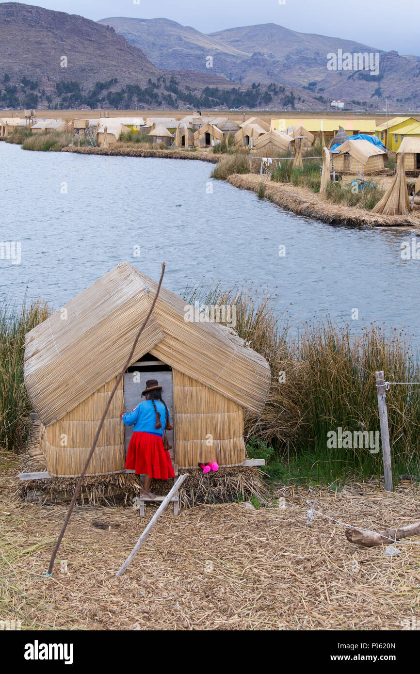 Local residents of floating reed islands of Uros, Lake Titicaca, Peru ...