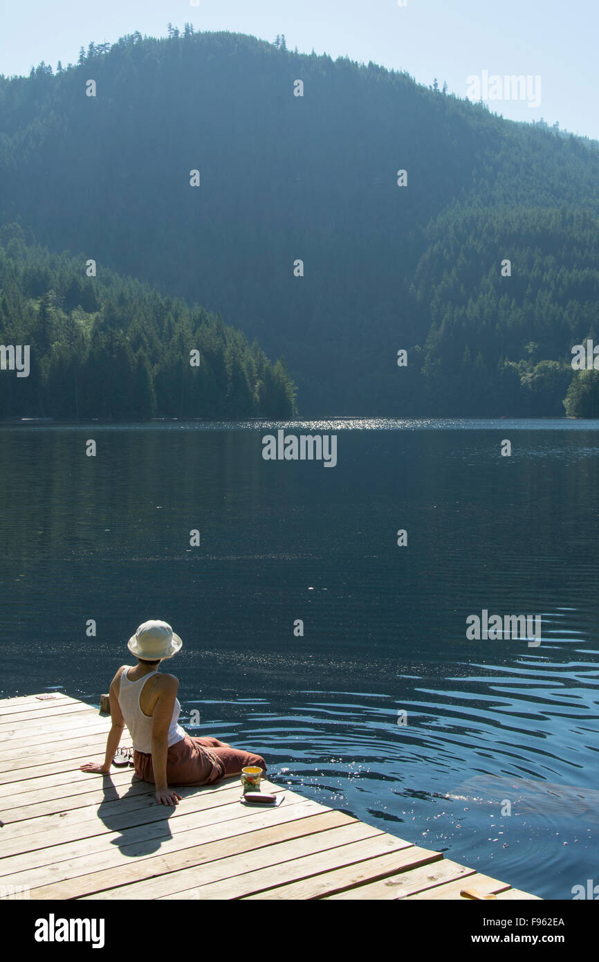 Woamn enjoying morning tea on Klein Lake near Egmont, , Sunshine Coast ...