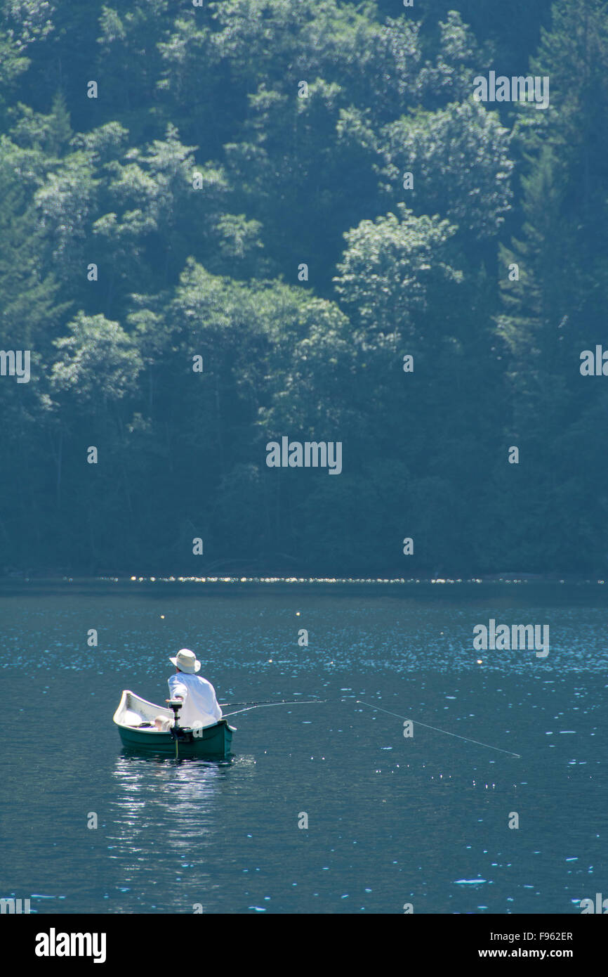 Man canoe fishing on Klein Lake near Egmont, , Sunshine Coast, British ...