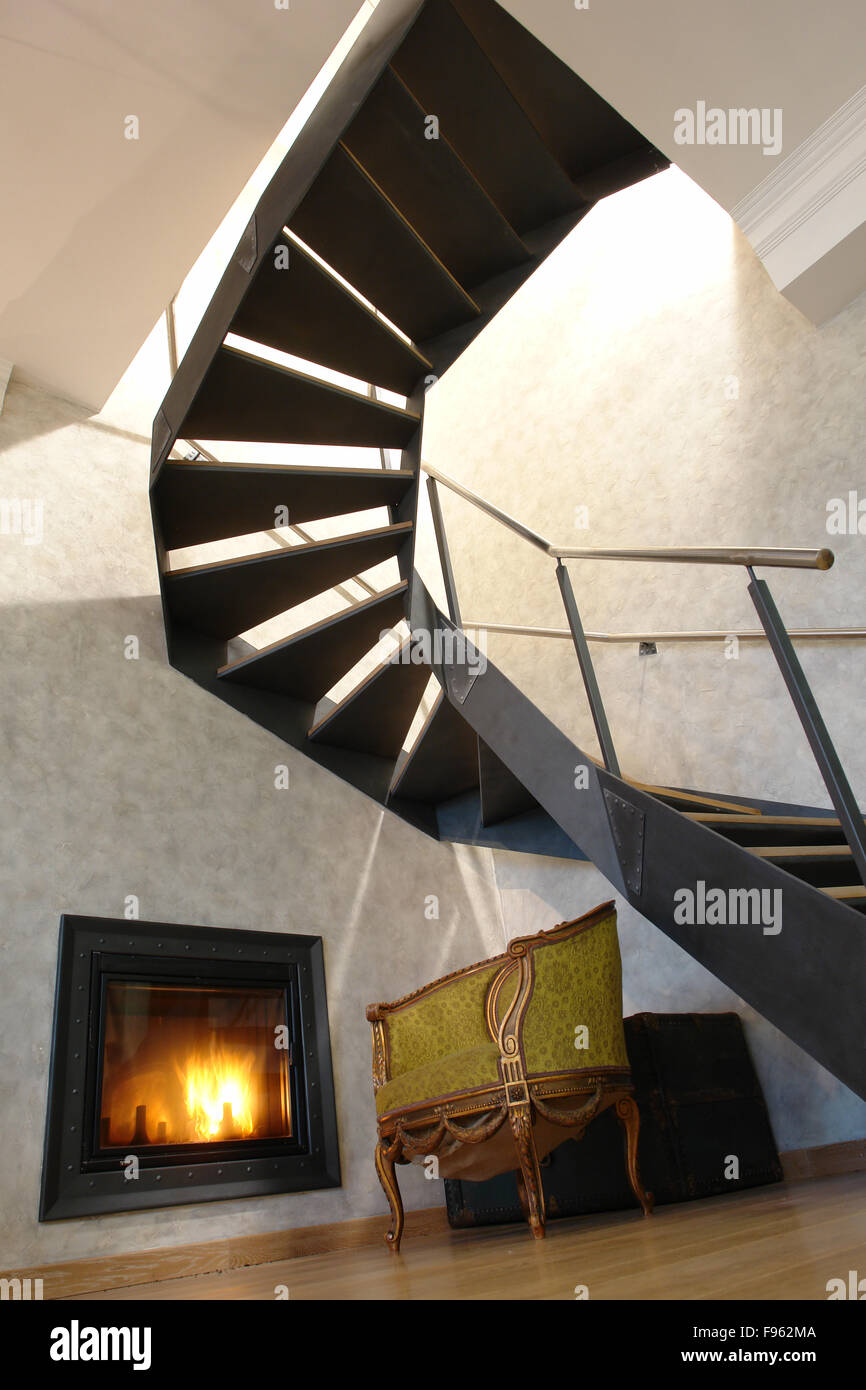 interior of a living room with fireplace and stair Stock Photo - Alamy