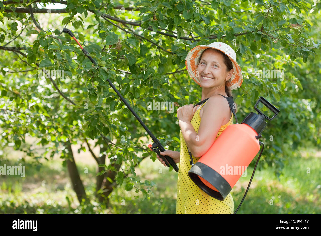 Female farmer holding branches hi-res stock photography and images - Alamy