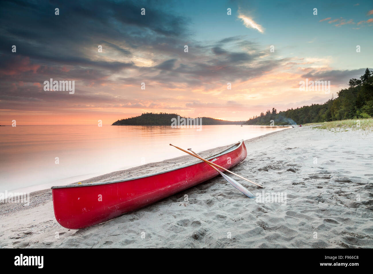 Red canoe at sunset on Gargantua Bay, Lake Superior Provincial Park ...
