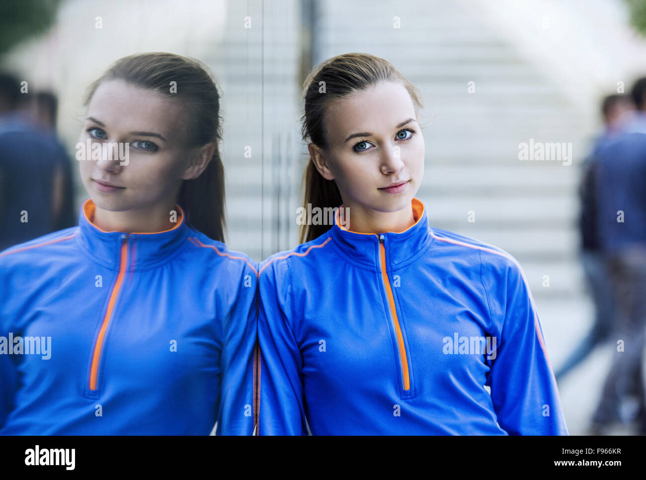Young female runner is having break during the run in city center Stock ...