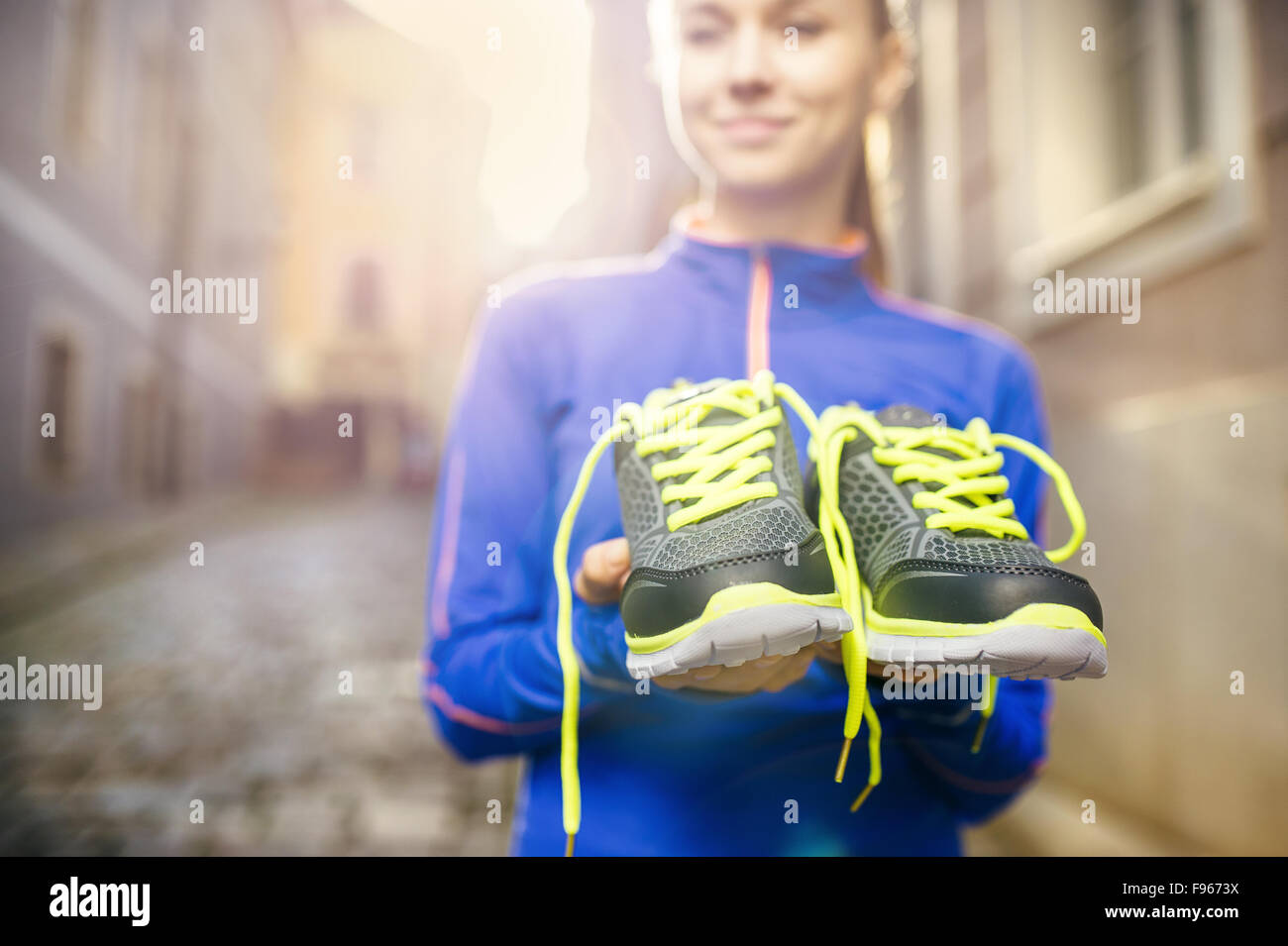 Beautiful young woman carrying shoes hi-res stock photography and ...
