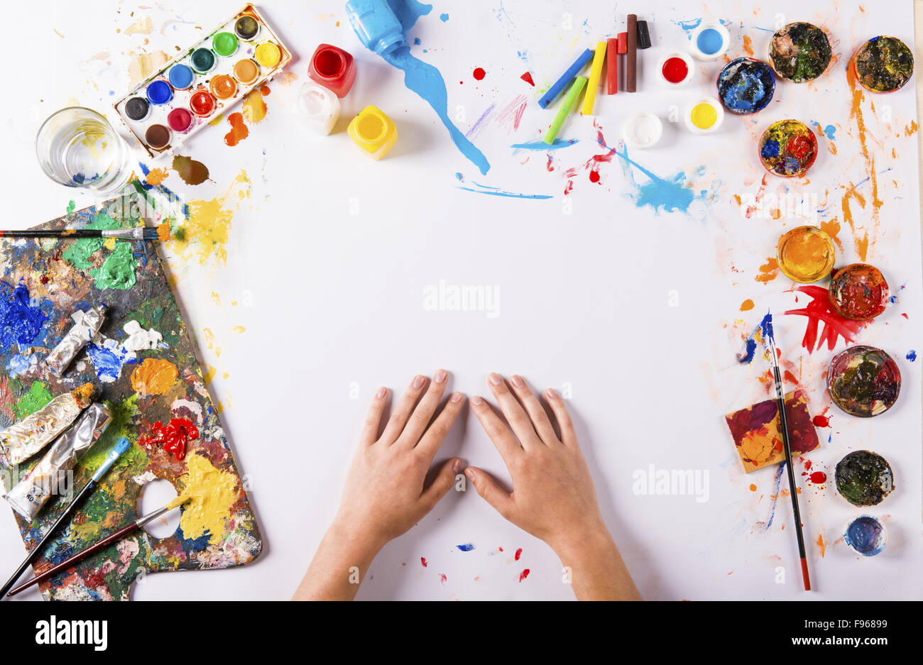 Creative art concept with colorful paints over white paper Stock Photo - Alamy
