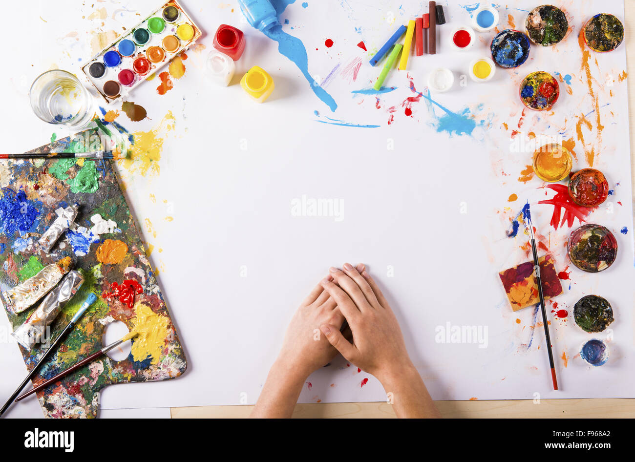 Creative art concept with colorful paints over white paper Stock Photo ...