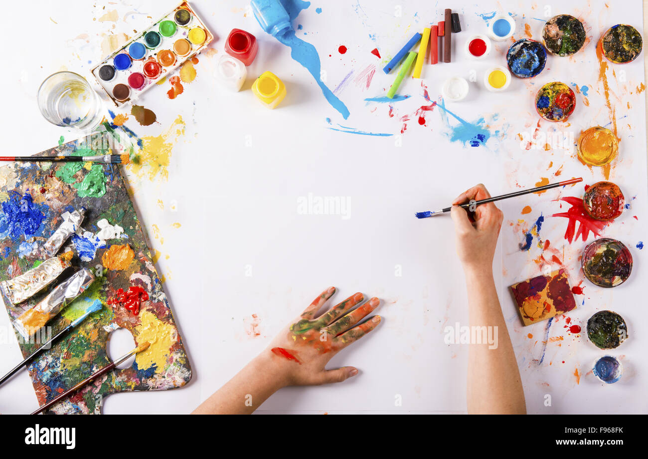 Creative art concept with colorful paints over white paper Stock Photo ...