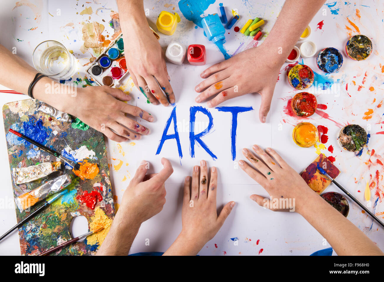 Creative art concept with colorful paints over white paper Stock Photo ...