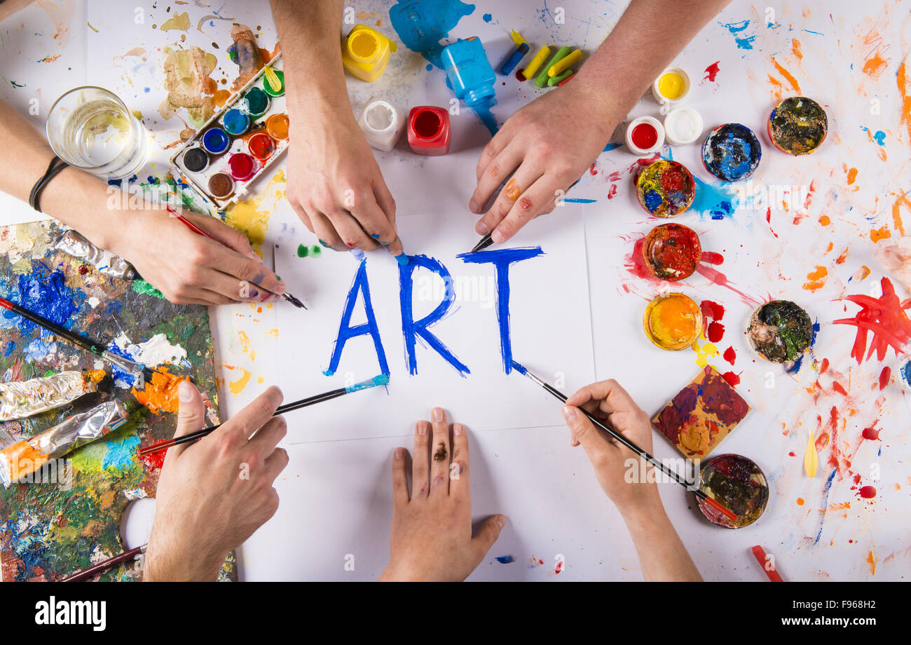 Creative art concept with colorful paints over white paper Stock Photo ...