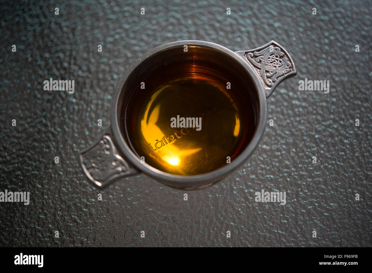 Silver quaich filled with whisky Stock Photo - Alamy