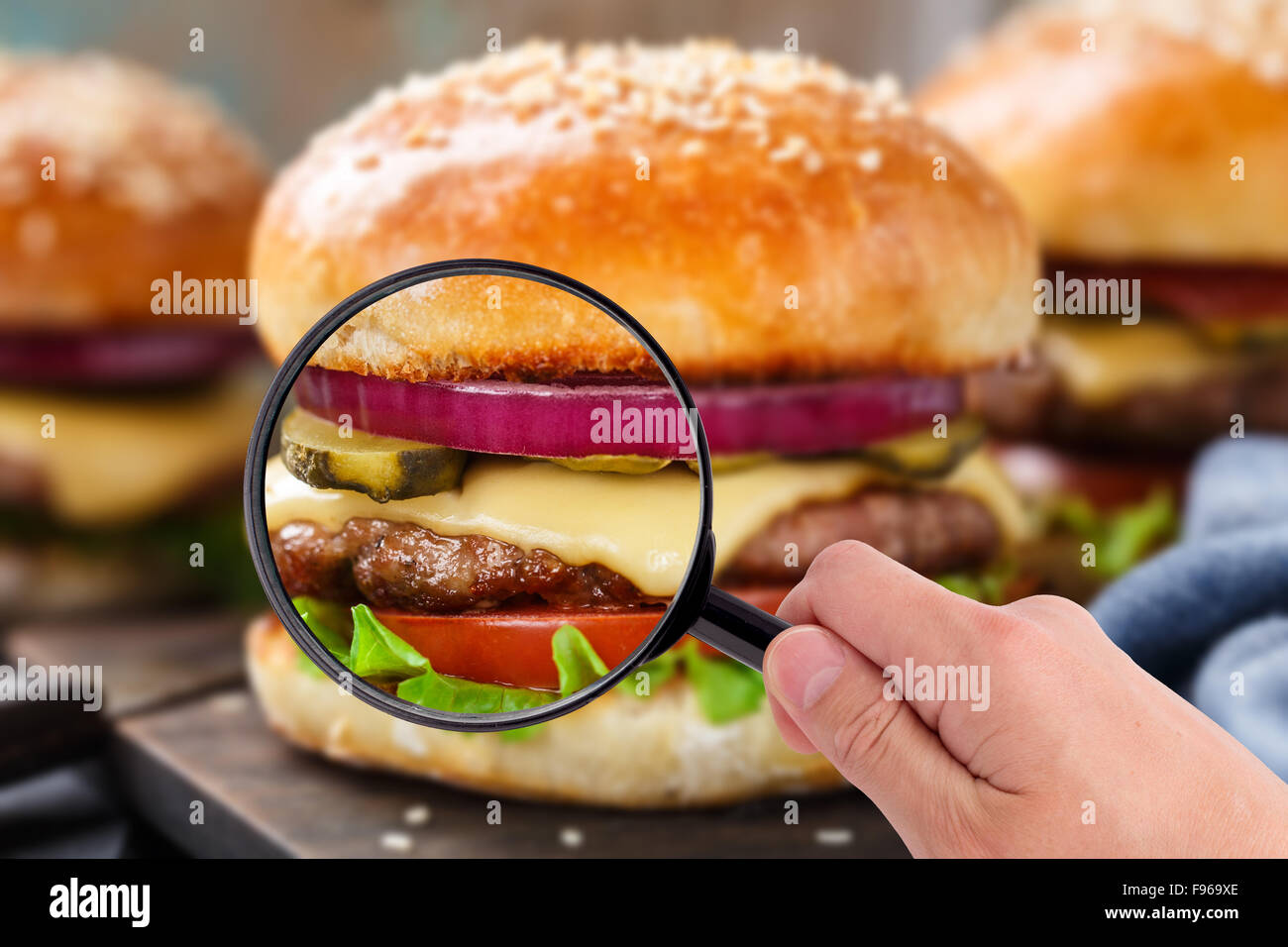 Magnifying glass examining burger hi-res stock photography and images ...