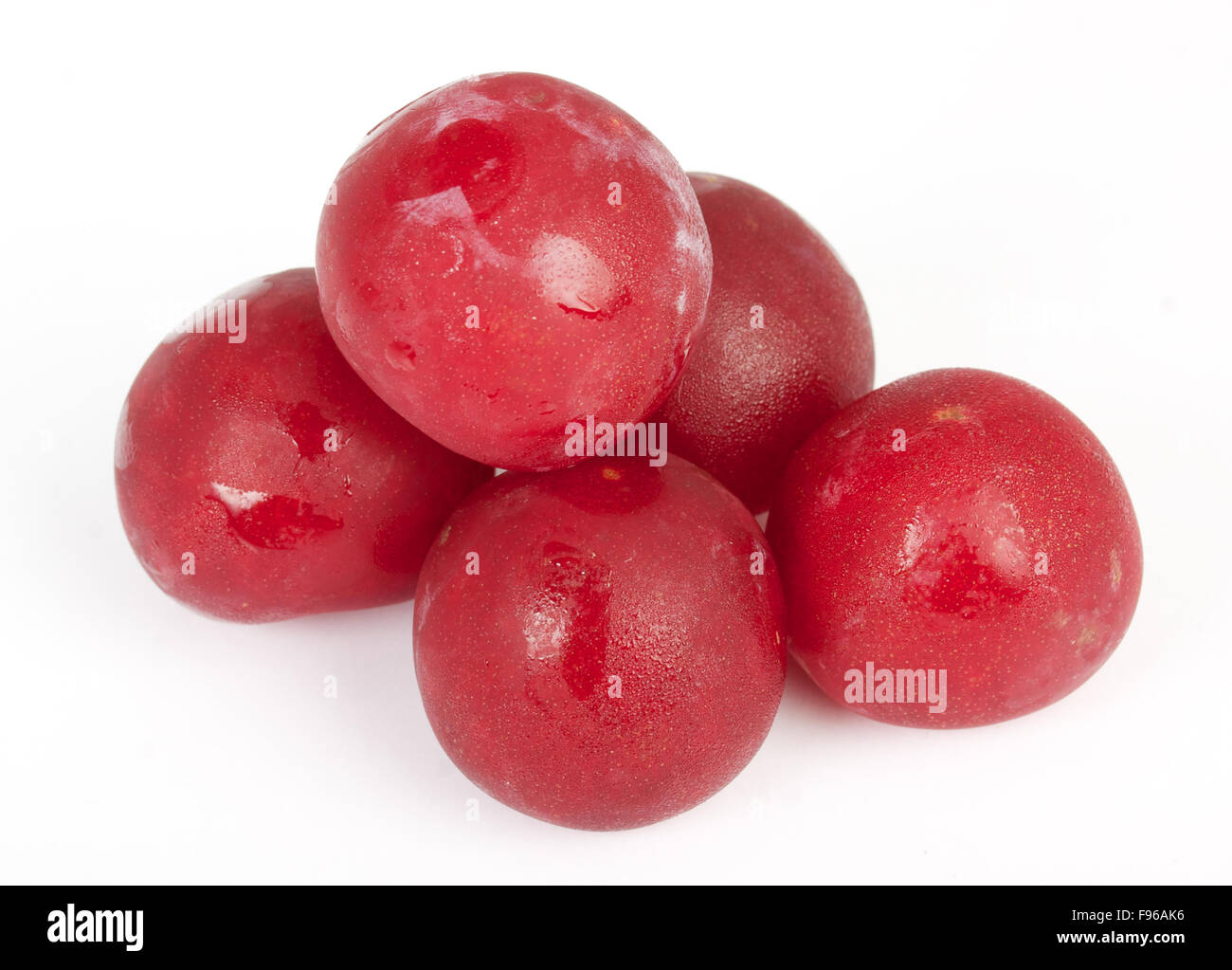 Shiny purple plum isolated against white background Stock Photo - Alamy