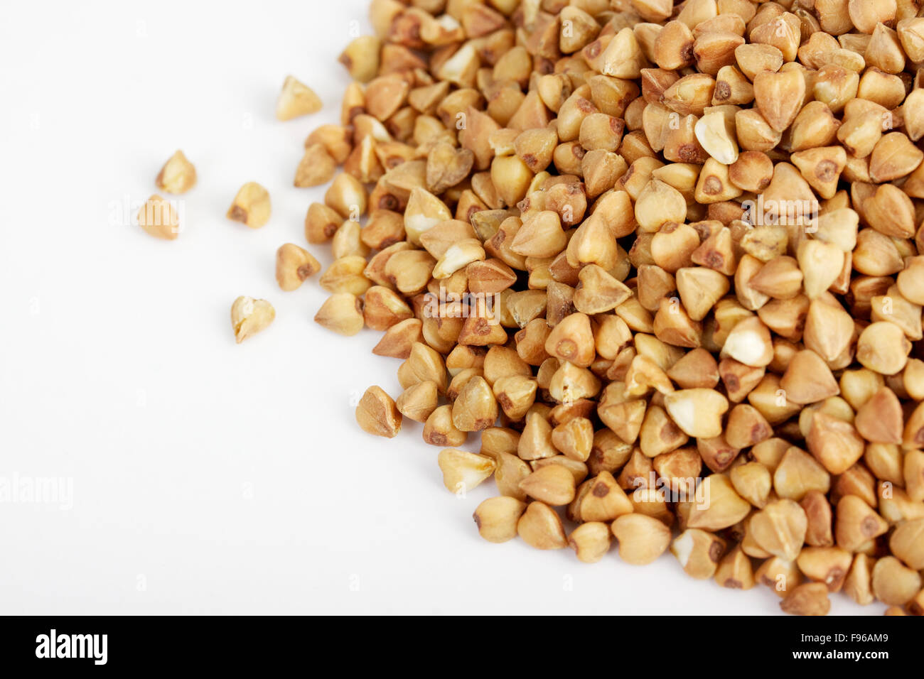 Buckwheat seeds closeup isolated on white background Stock Photo - Alamy
