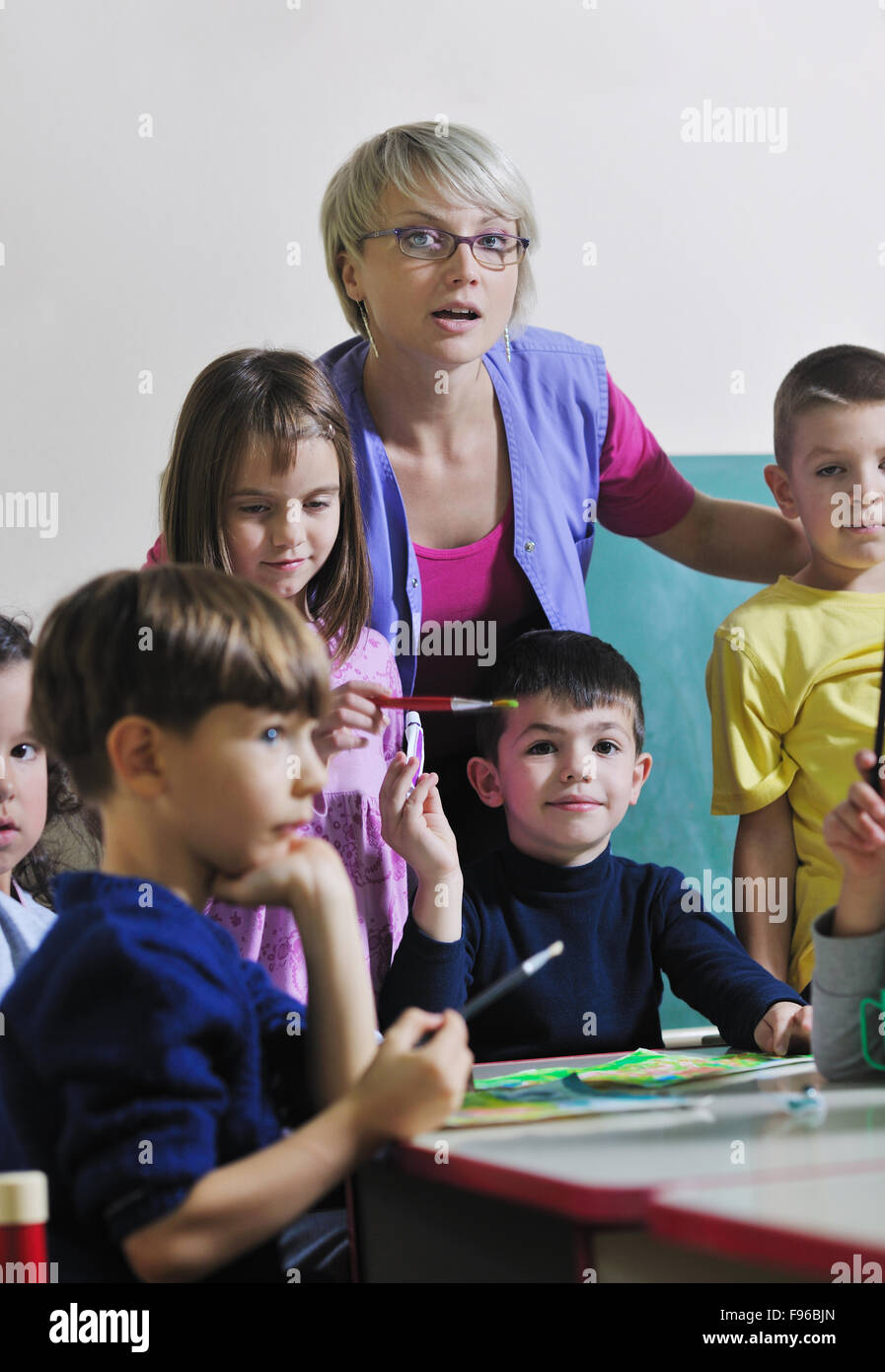 happy child kids group have fun and play at kindergarden indoor ...