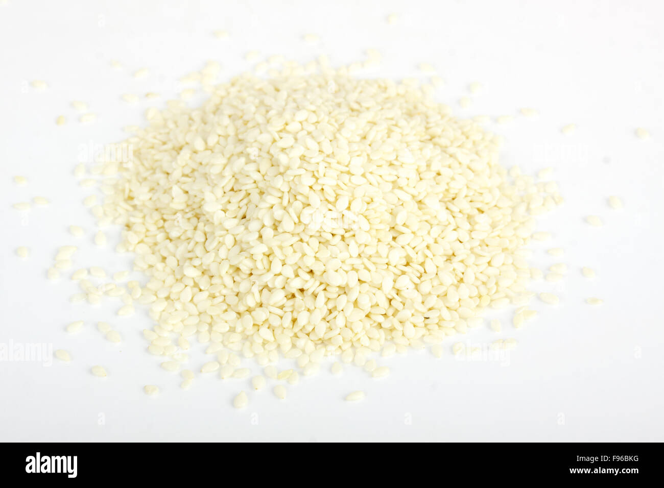 A close up on a pile of dried Sesame Seed isolated on a white ...