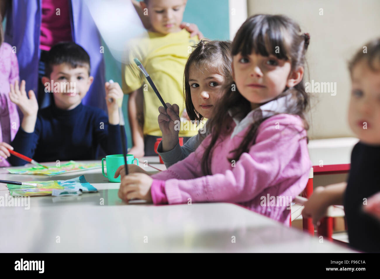 happy child kids group have fun and play at kindergarden indoor ...