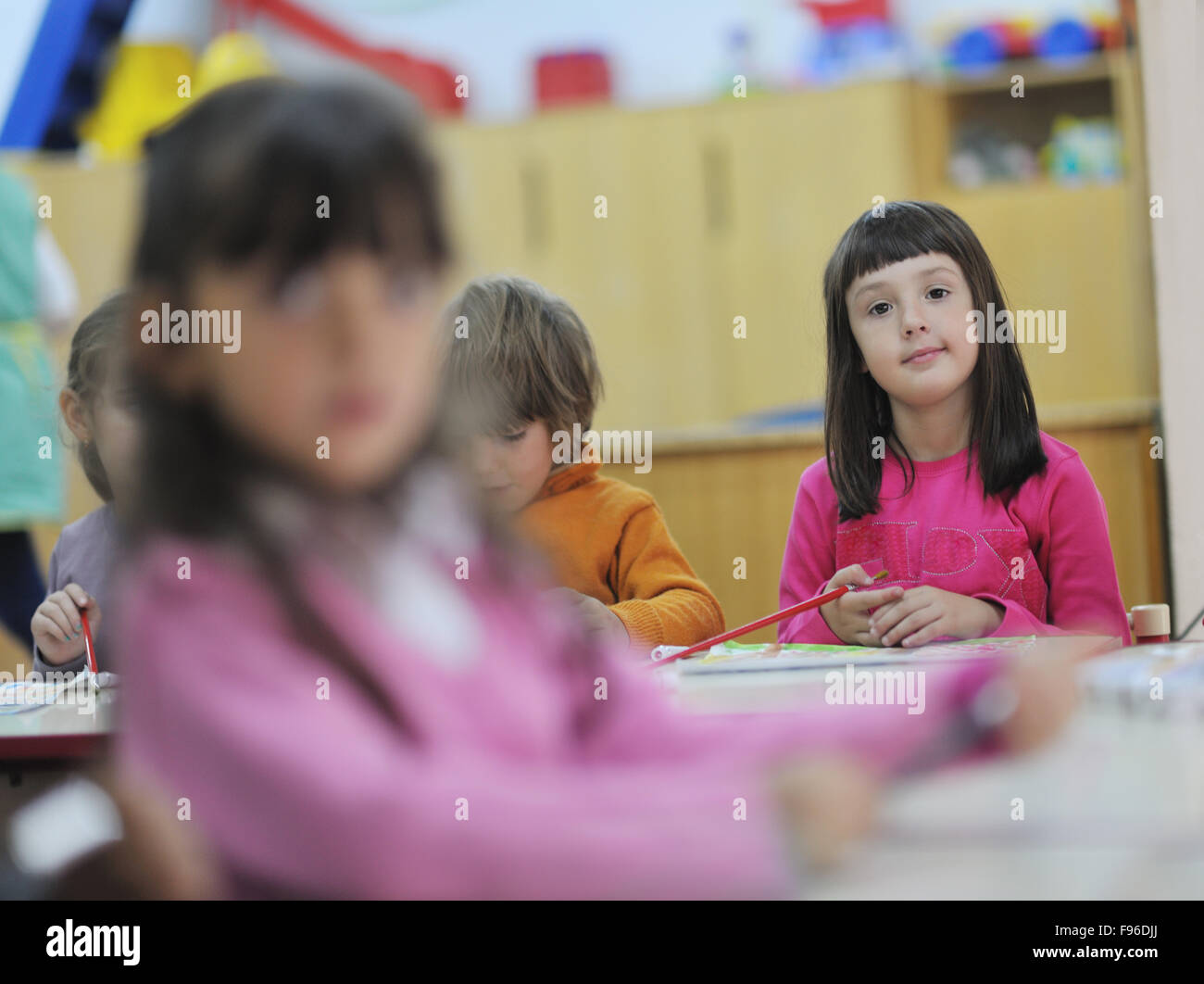 happy child kids group have fun and play at kindergarden indoor ...