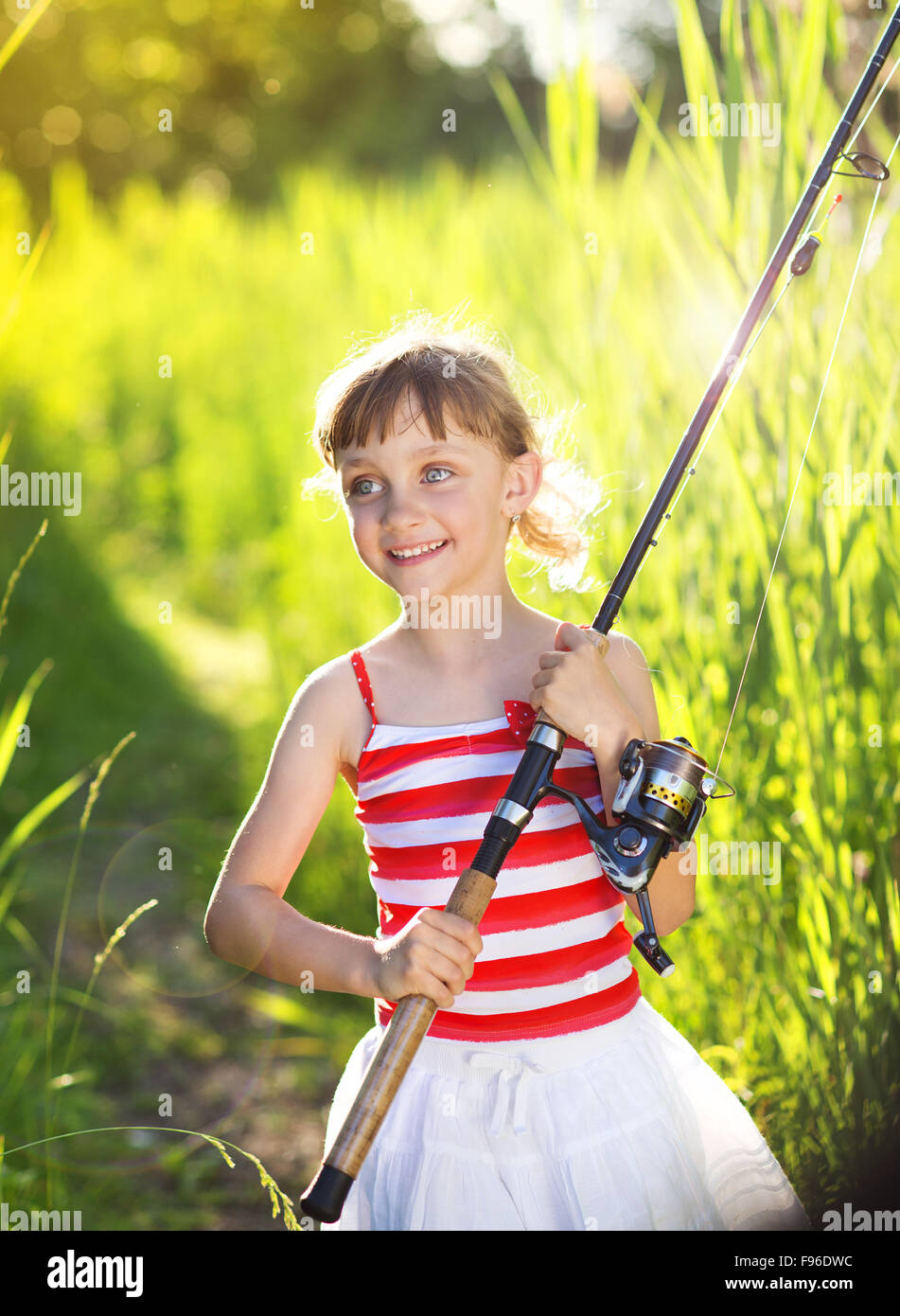 Girl with fish hook hi-res stock photography and images - Alamy