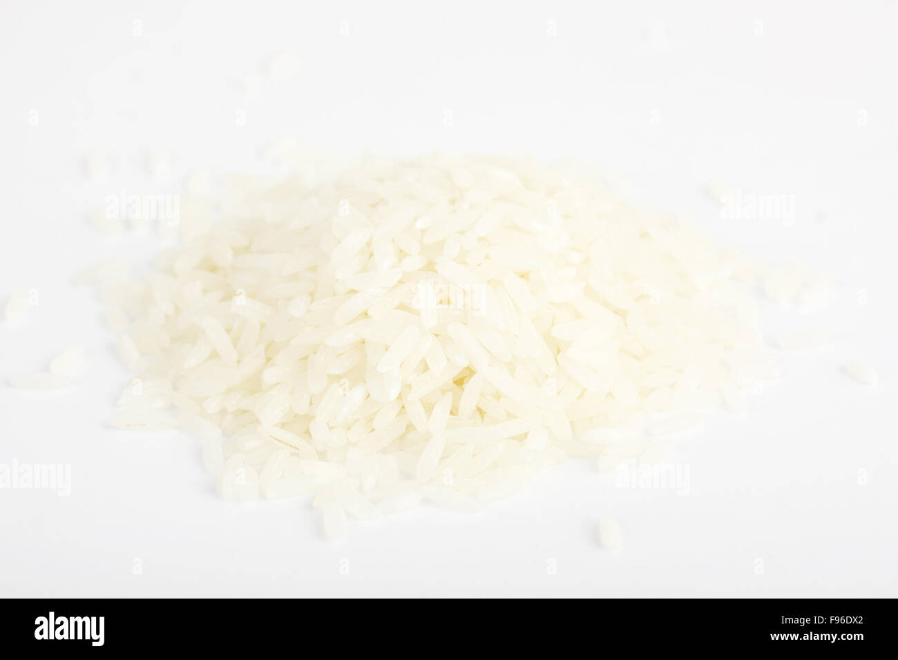 Pile of organic rice (on white Stock Photo - Alamy