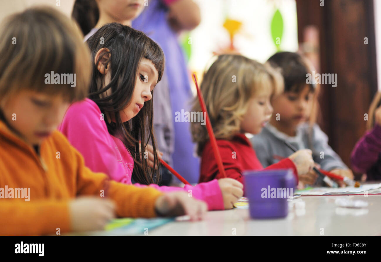 happy child kids group have fun and play at kindergarden indoor ...