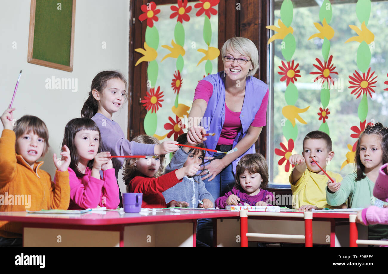 happy child kids group have fun and play at kindergarden indoor ...