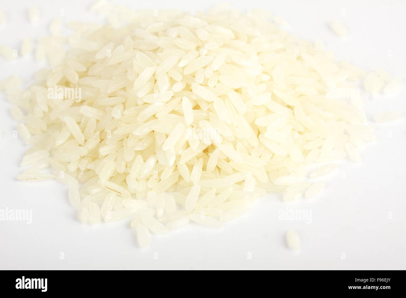 Pile of organic rice (on white Stock Photo - Alamy
