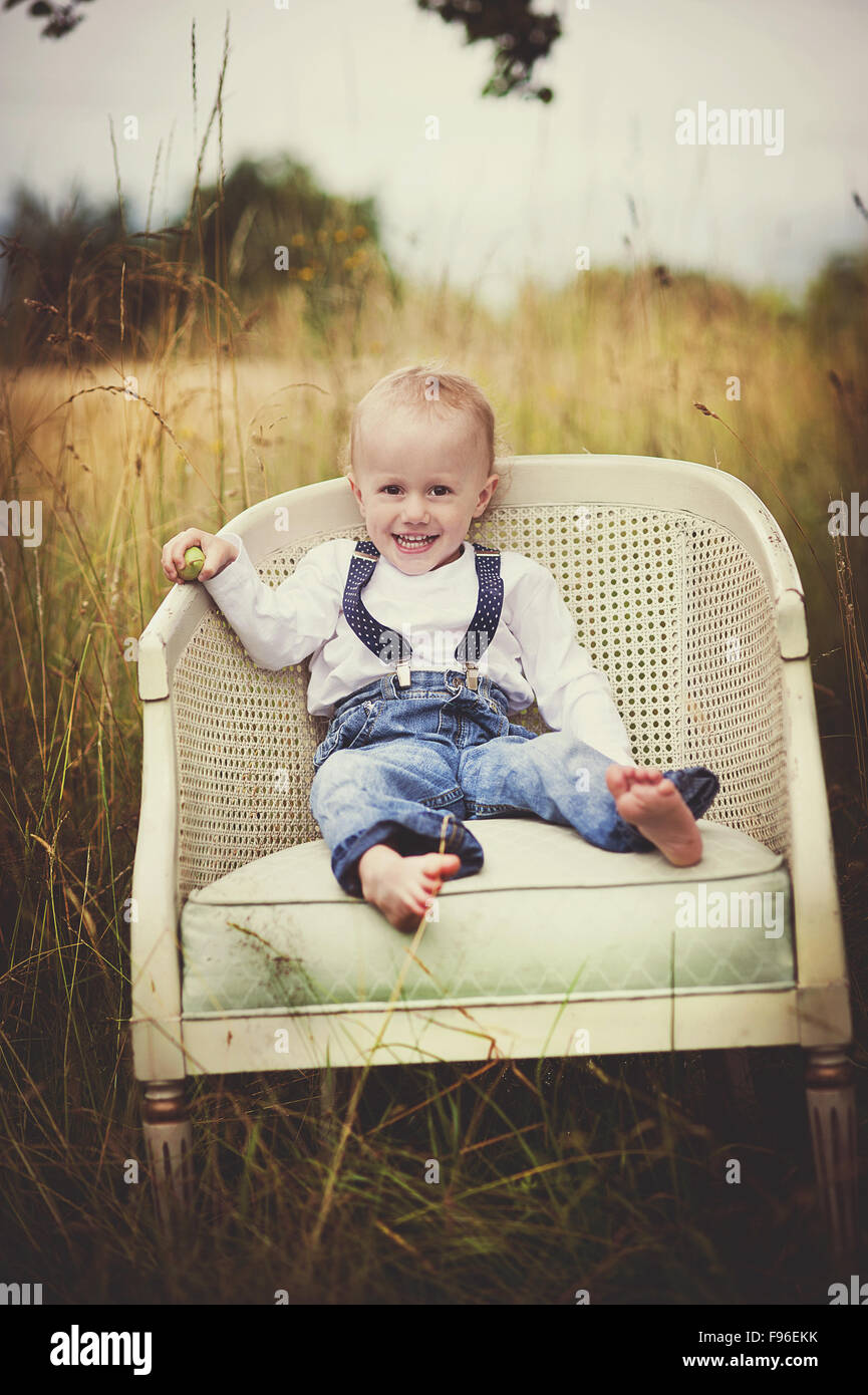Cute little boy spending time in nature Stock Photo - Alamy