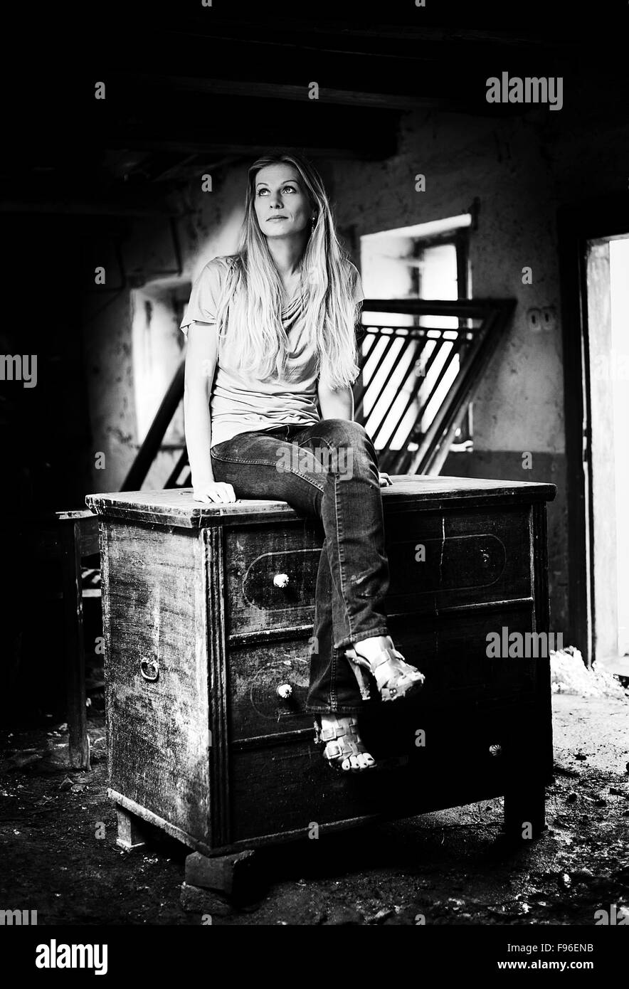 Outdoor portrait of beautiful woman posing by the old house Stock Photo ...