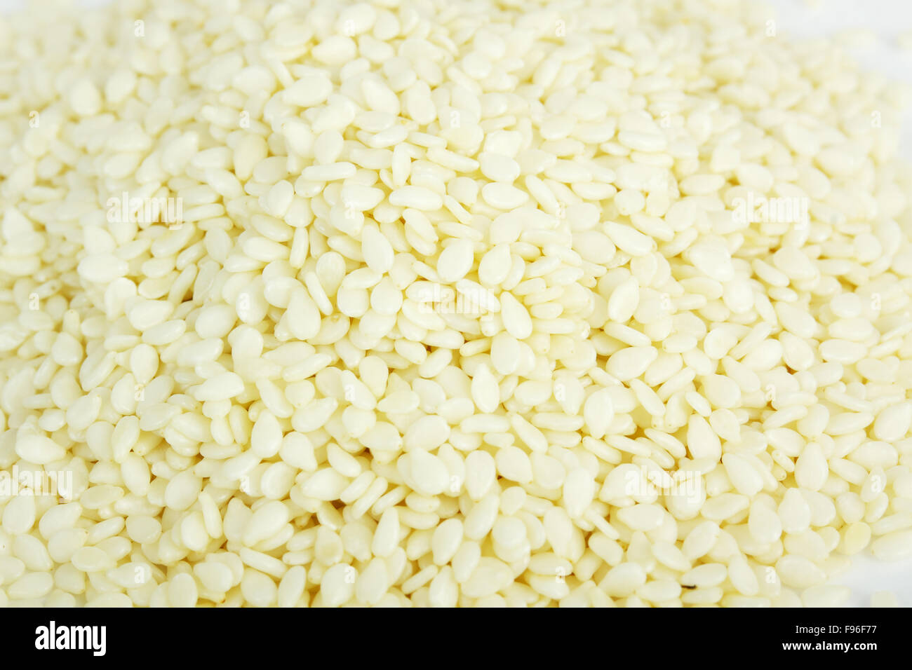 A close up on a pile of dried Sesame Seed isolated on a white ...