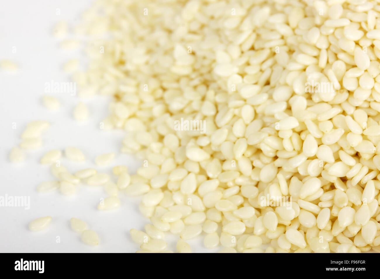 A close up on a pile of dried Sesame Seed isolated on a white ...