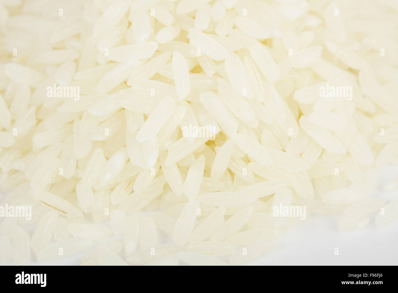 Pile of organic rice (on white Stock Photo - Alamy