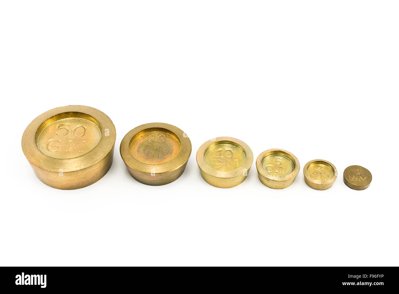 Brass weights of different size isolated on white Stock Photo - Alamy