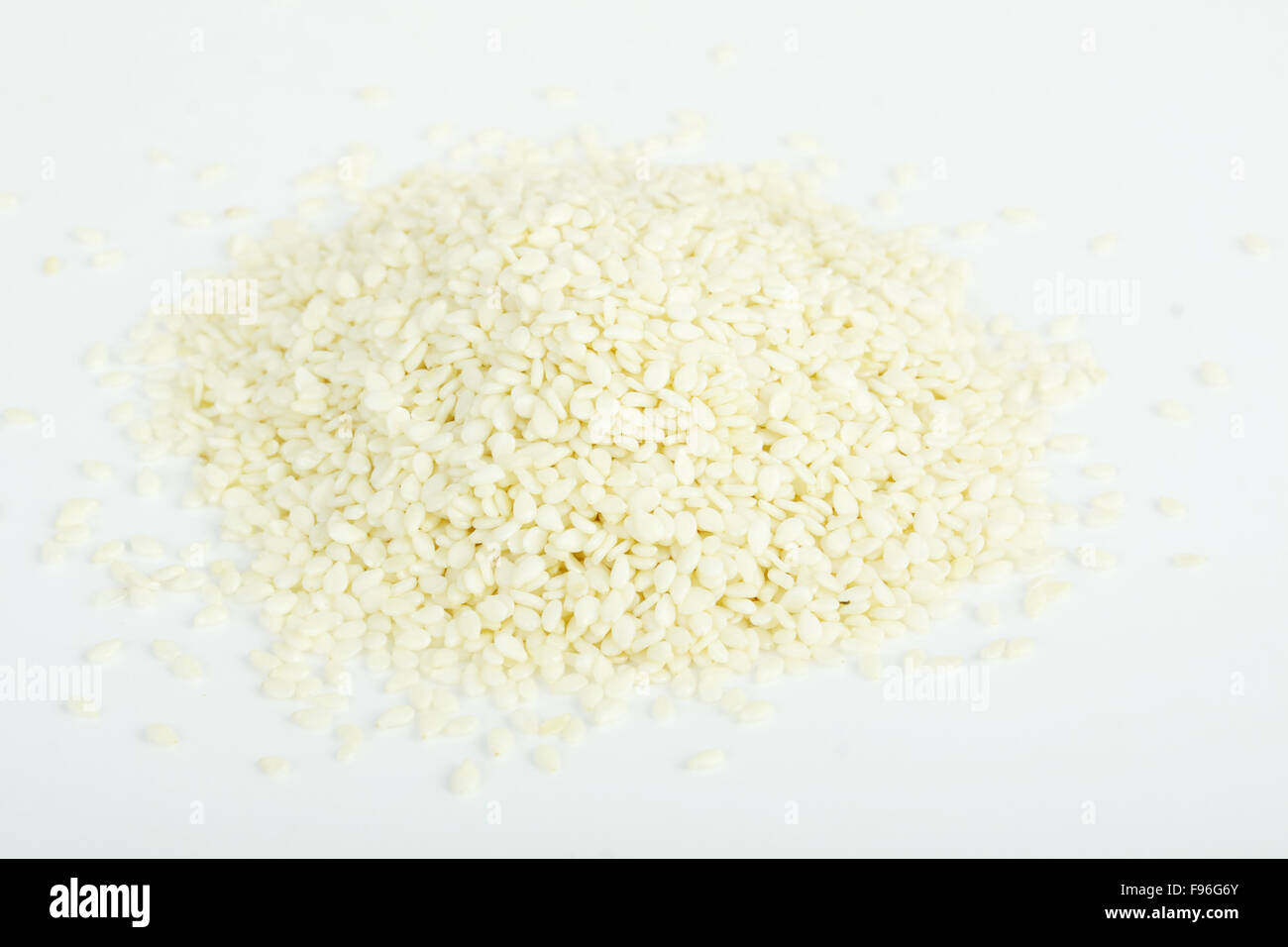 A close up on a pile of dried Sesame Seed isolated on a white ...