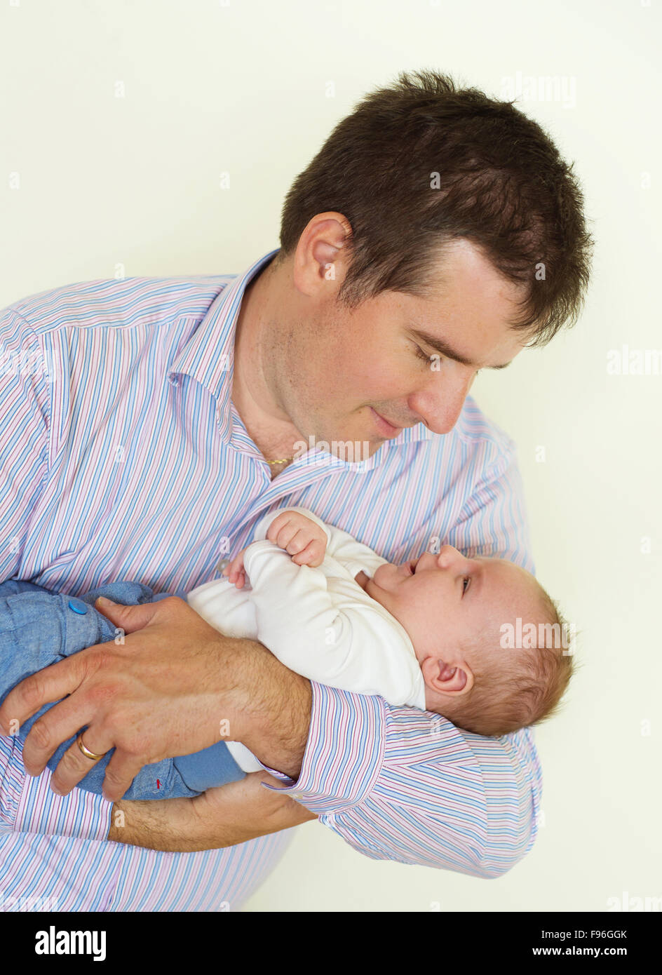 Cute newborn baby boy relaxing at home with his father Stock Photo - Alamy
