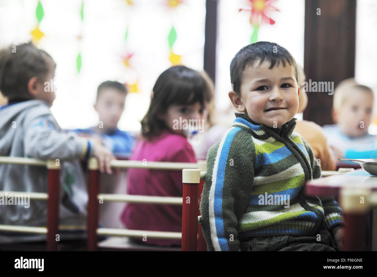 happy child kids group have fun and play at kindergarden indoor ...