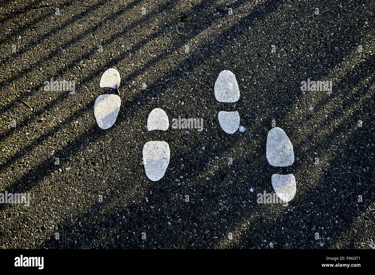 Painted foot steps showing which side of the walkway to walk on for the ...
